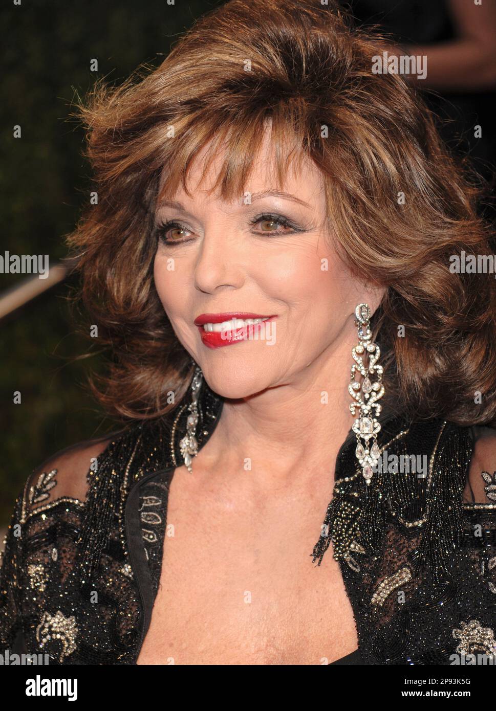 Actress Joan Collins arrives at the Vanity Fair Oscar party on Sunday ...