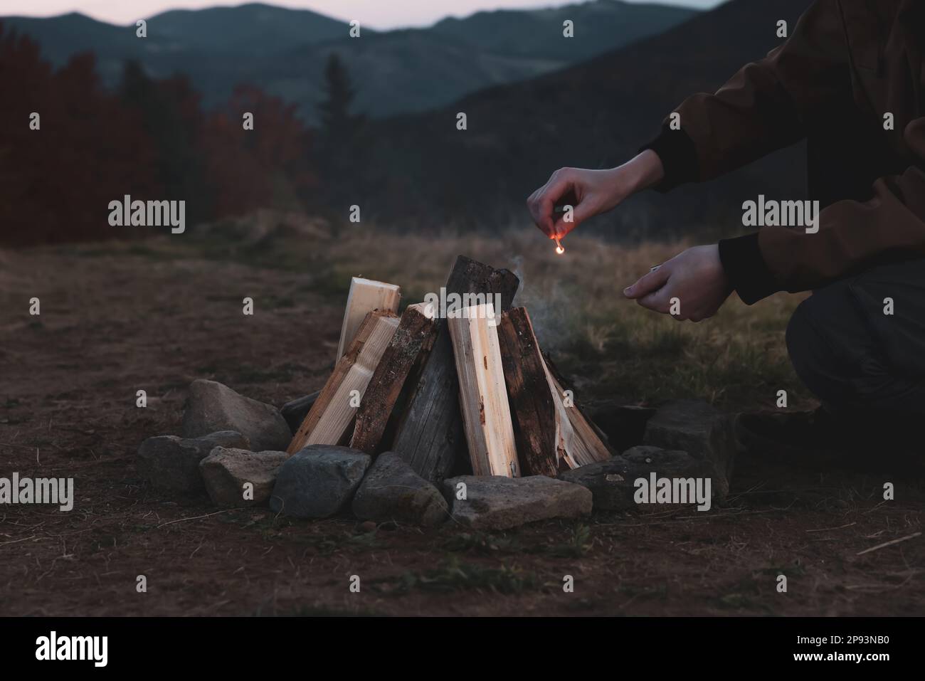 Person lighting matchstick outdoors hi-res stock photography and images ...