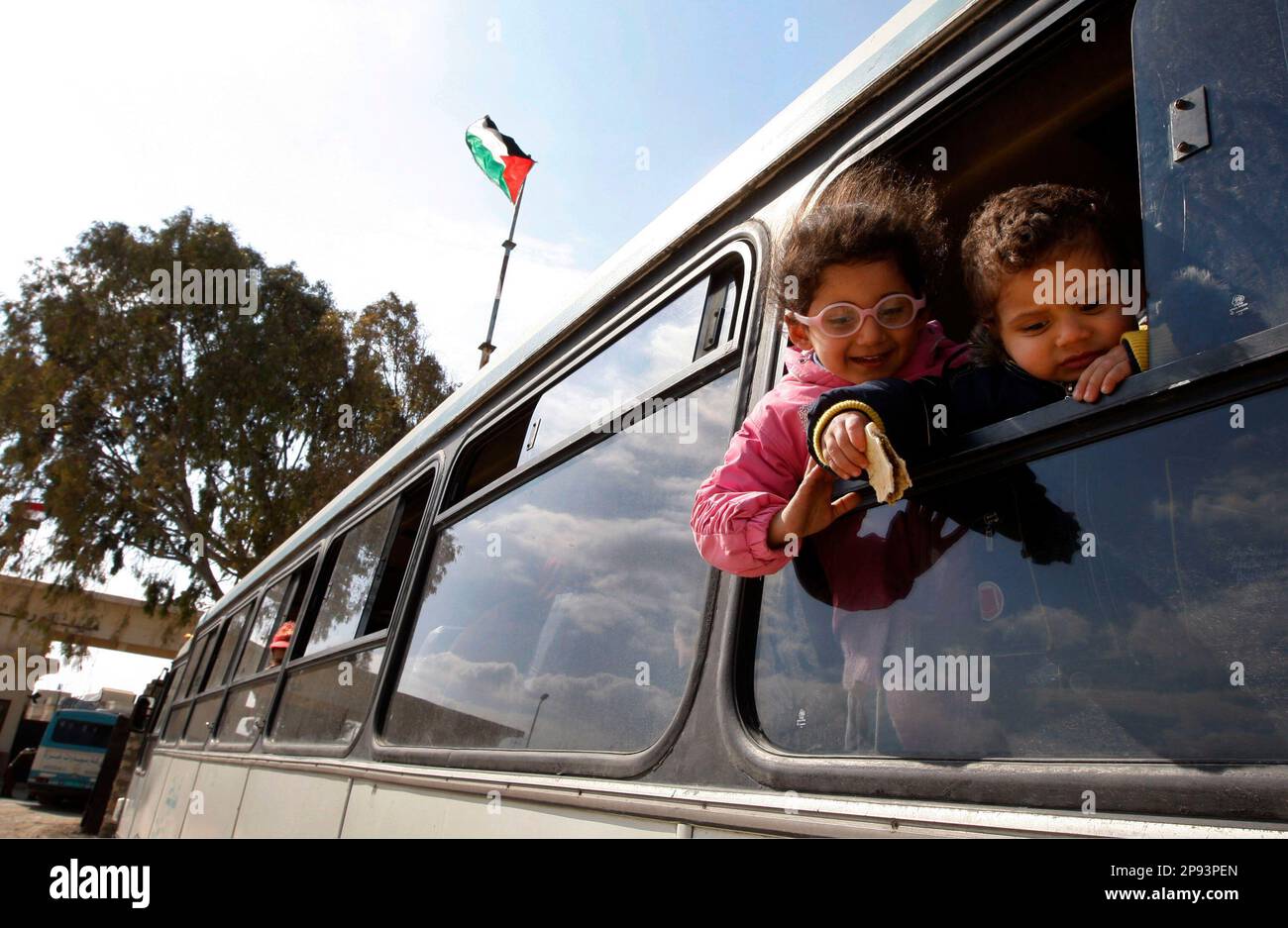Palestinian children are seen on a bus as they wait to cross to Egypt ...