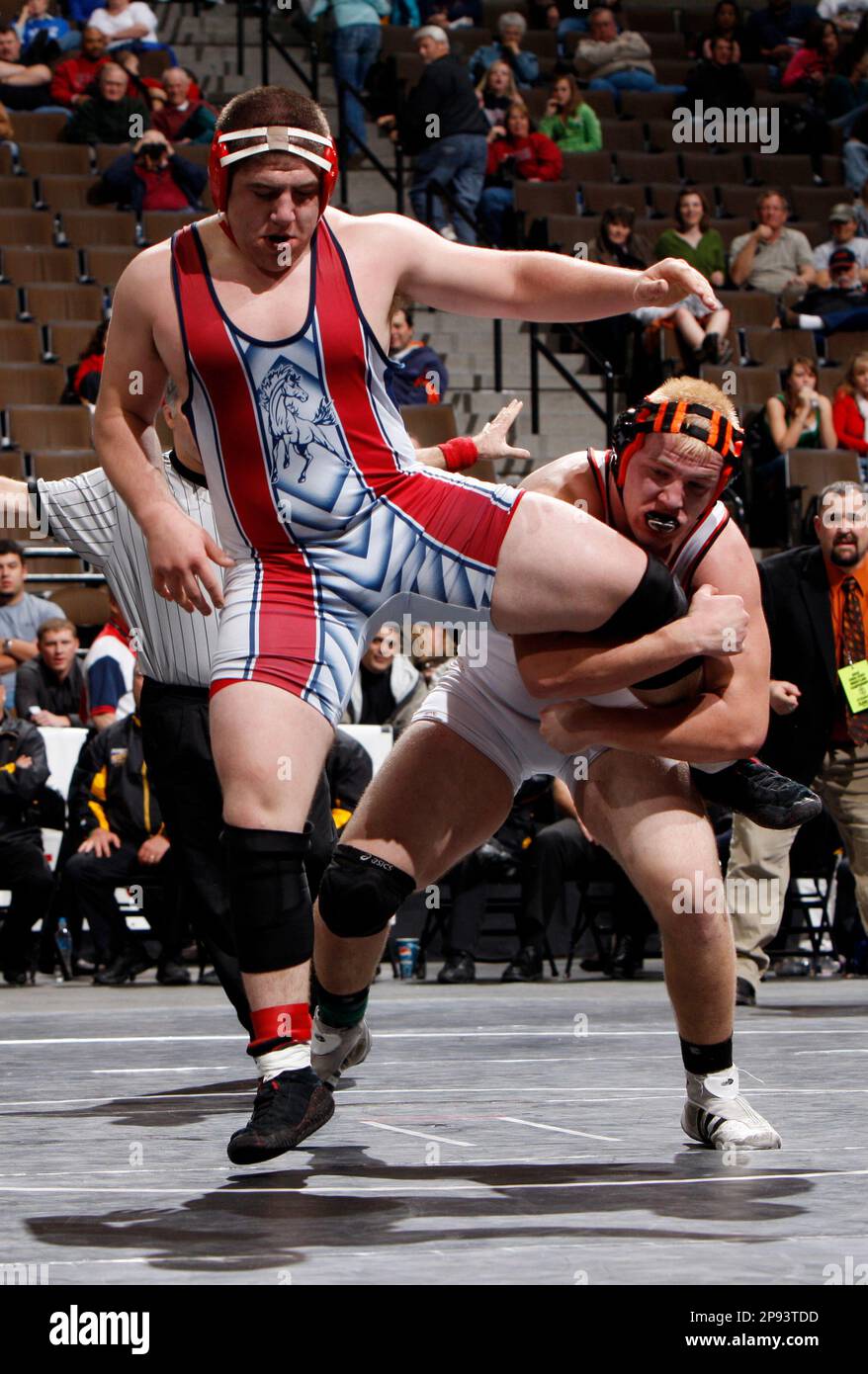 Crowley County's billy Gray, left, struggles to break free from Wiggins' Kyle Pollock on the way ...