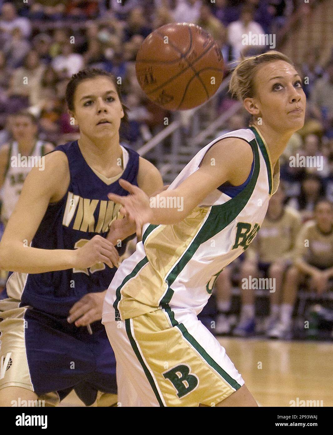 Bonneville's Kylee Searle (5) and Middleton's Jenni foreman (10) go for ...