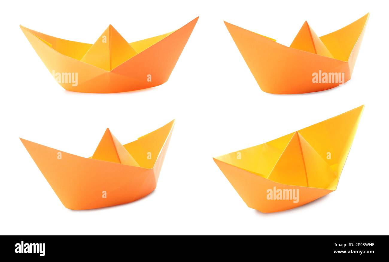 Set with orange paper boats on white background Stock Photo - Alamy