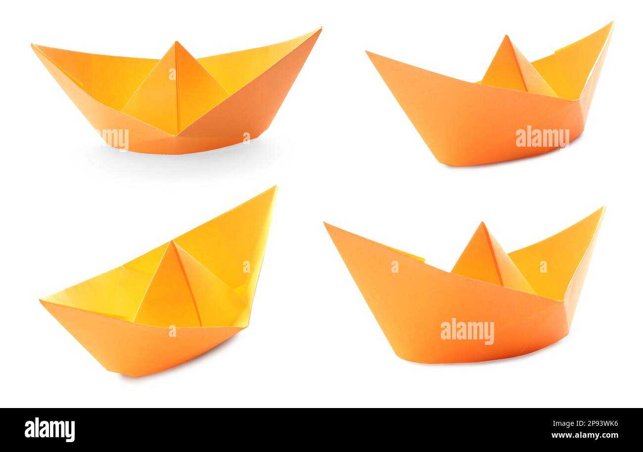 Set with orange paper boats on white background Stock Photo - Alamy