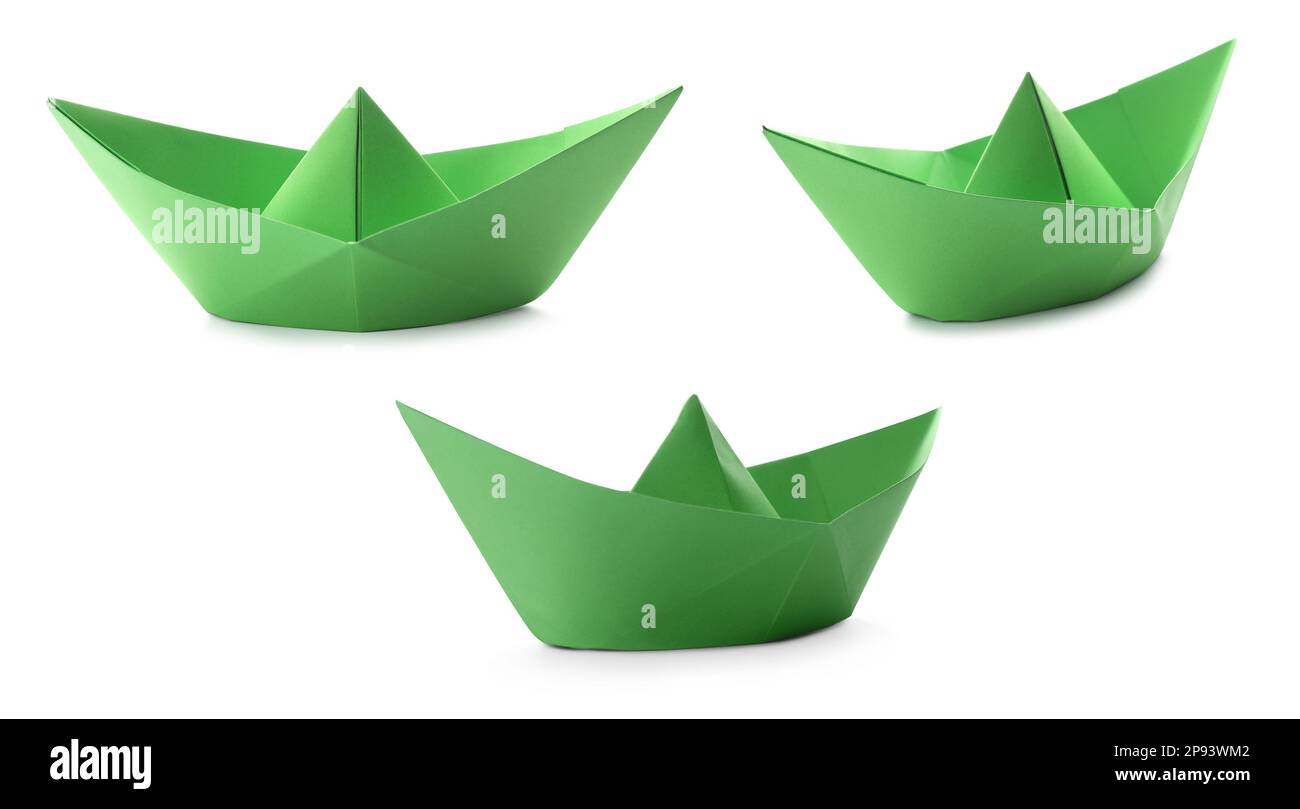 Set with green paper boats on white background Stock Photo - Alamy