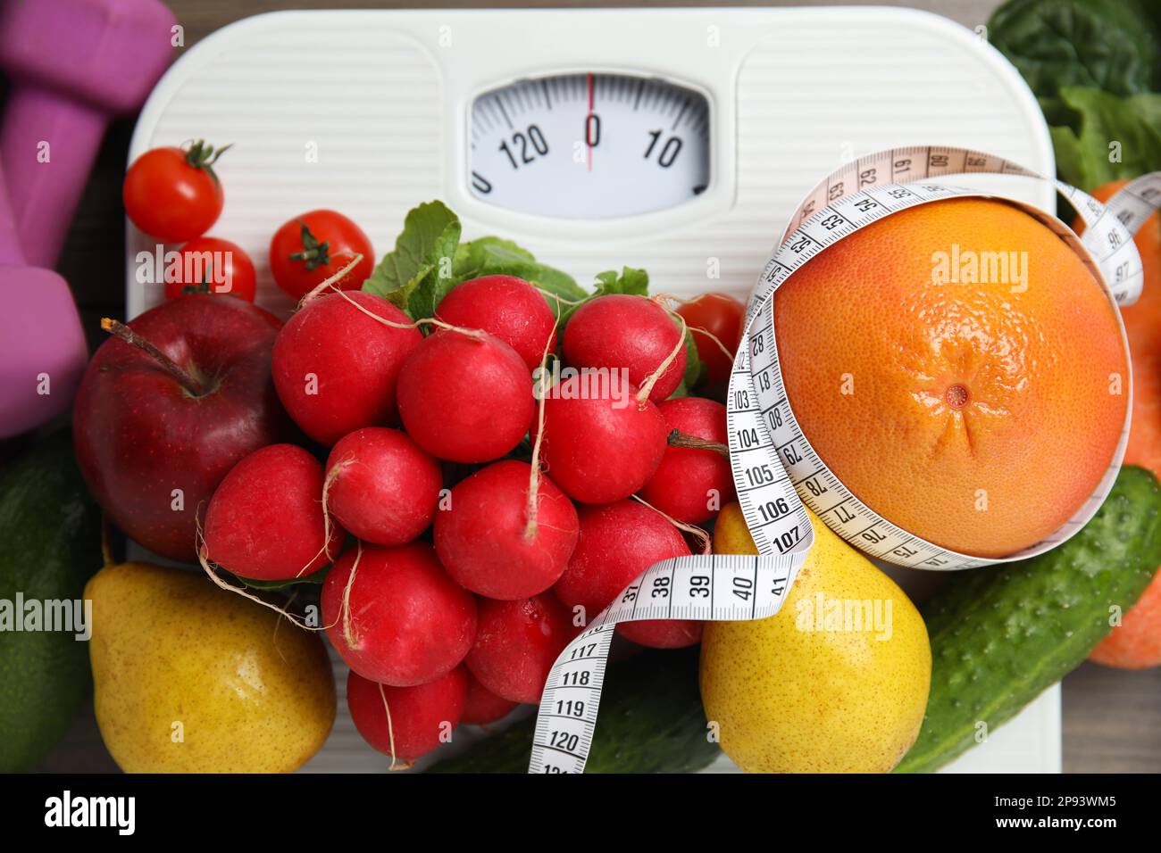 Fresh healthy food on scales, top view Stock Photo - Alamy