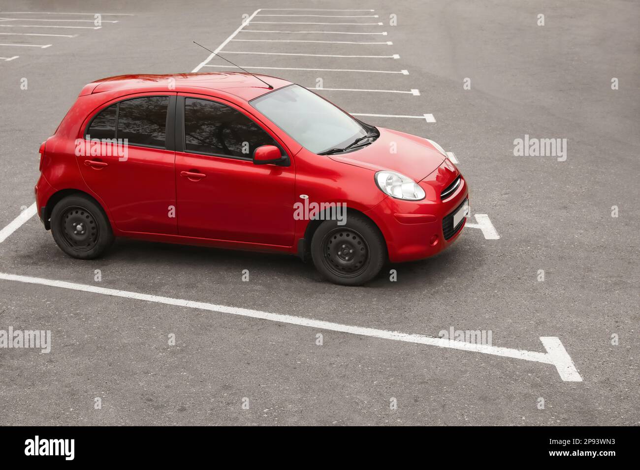Modern red car on parking lot outdoors Stock Photo - Alamy