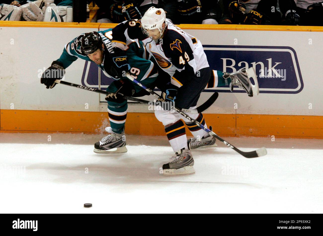 San Jose Sharks' Joe Thornton, left, and Atlanta Thrashers' Colin ...