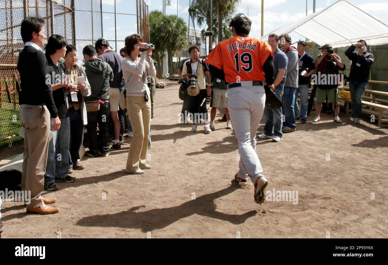 Baltimore Orioles starting pitcher Koji Uehara, of Japan, jogs through ...