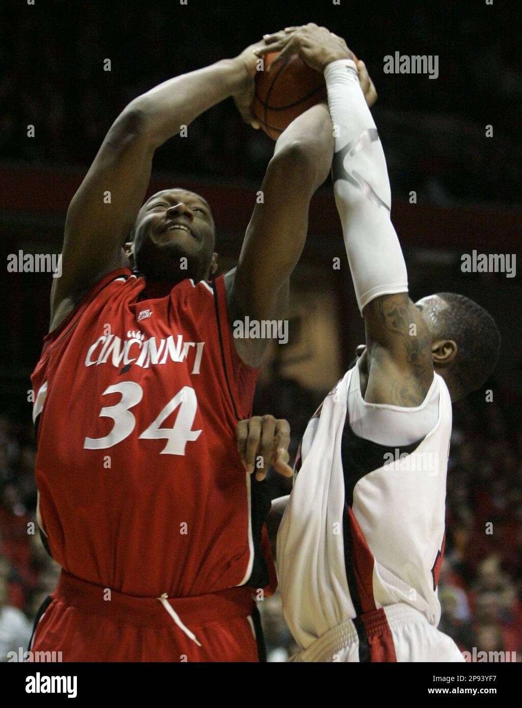 Louisville forward Terrence Williams blocks a shot by Cincinnati ...