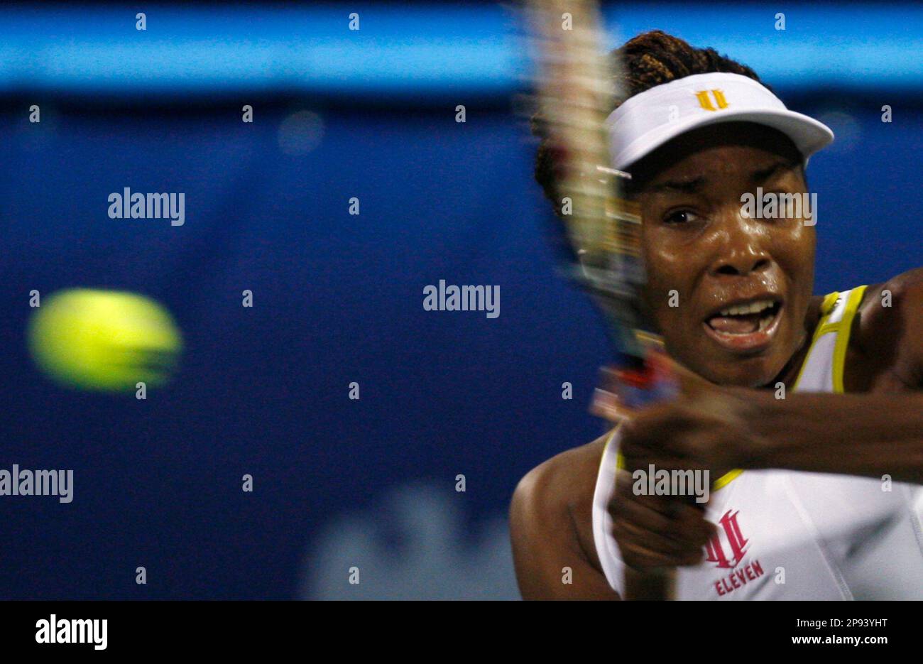 Venus Williams from U.S. returns the ball to France's Virginie Razzano ...