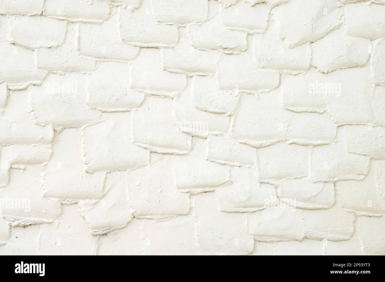 Concrete render creating a pattern on the wall of an old clay lump ...