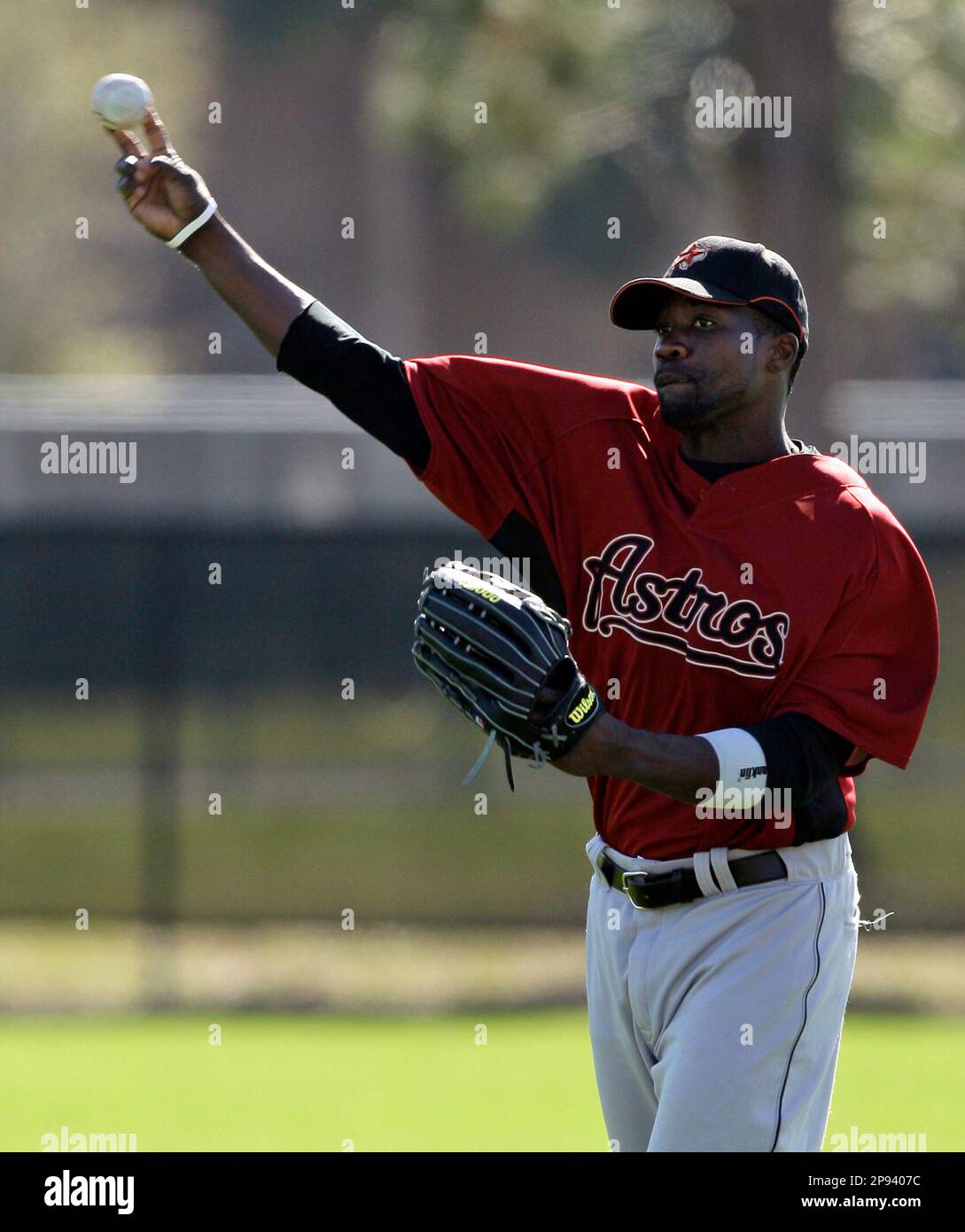 Houston Astros outfielder Reggie Abercrombie throws during a spring ...