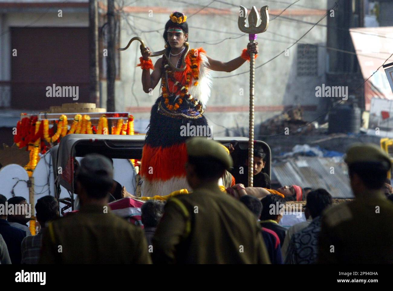 A devotee, dressed as Hindu God Shiva, participates in a religious ...