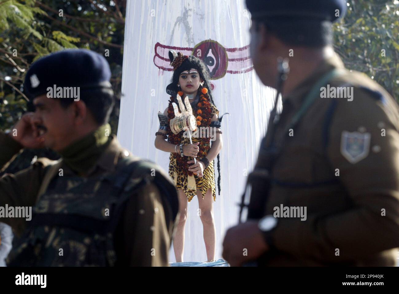 A child artist, dressed as Hindu God Shiva, participates in a religious ...