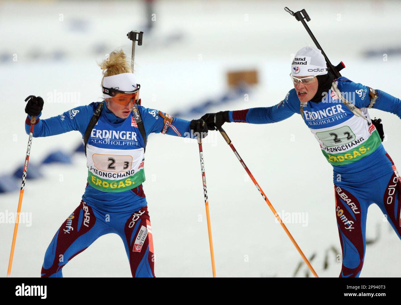 Sylvie Becaert, right, changes over to Marie Dorin, both from France ...