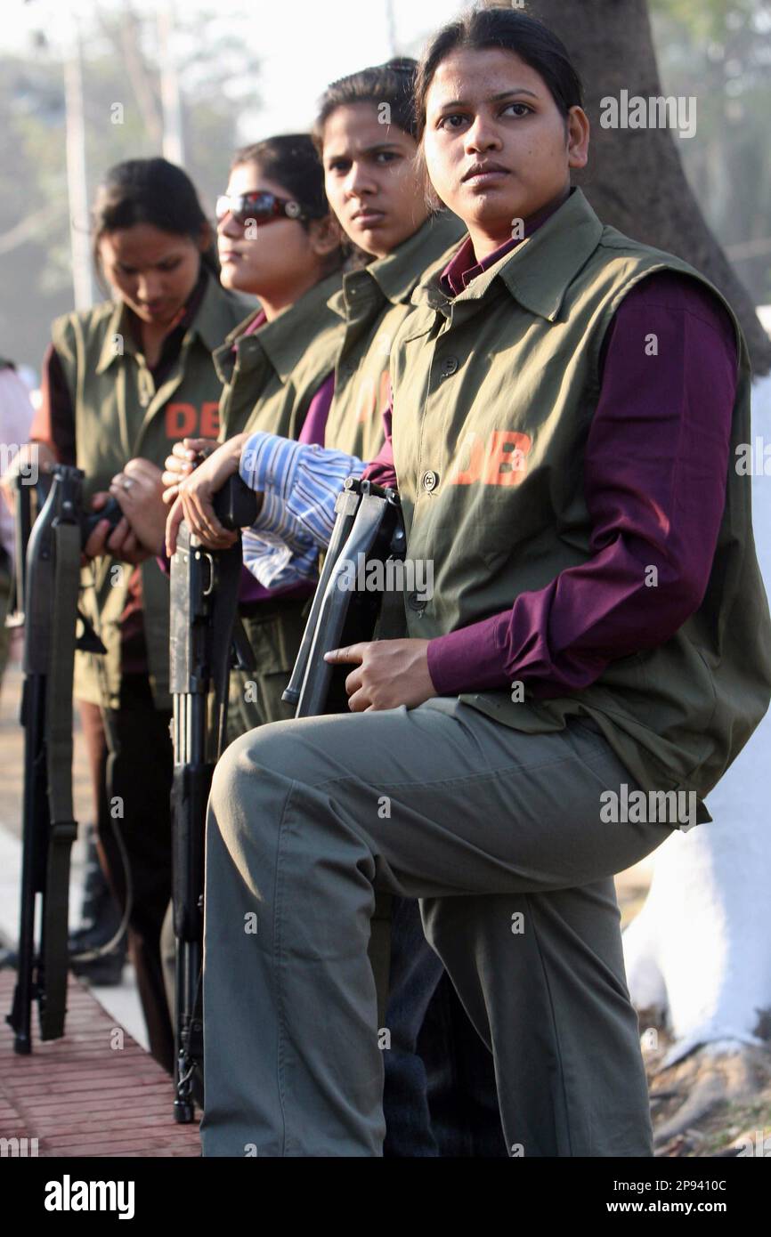 Women officers from the police Detective Branch stand guard in the ...