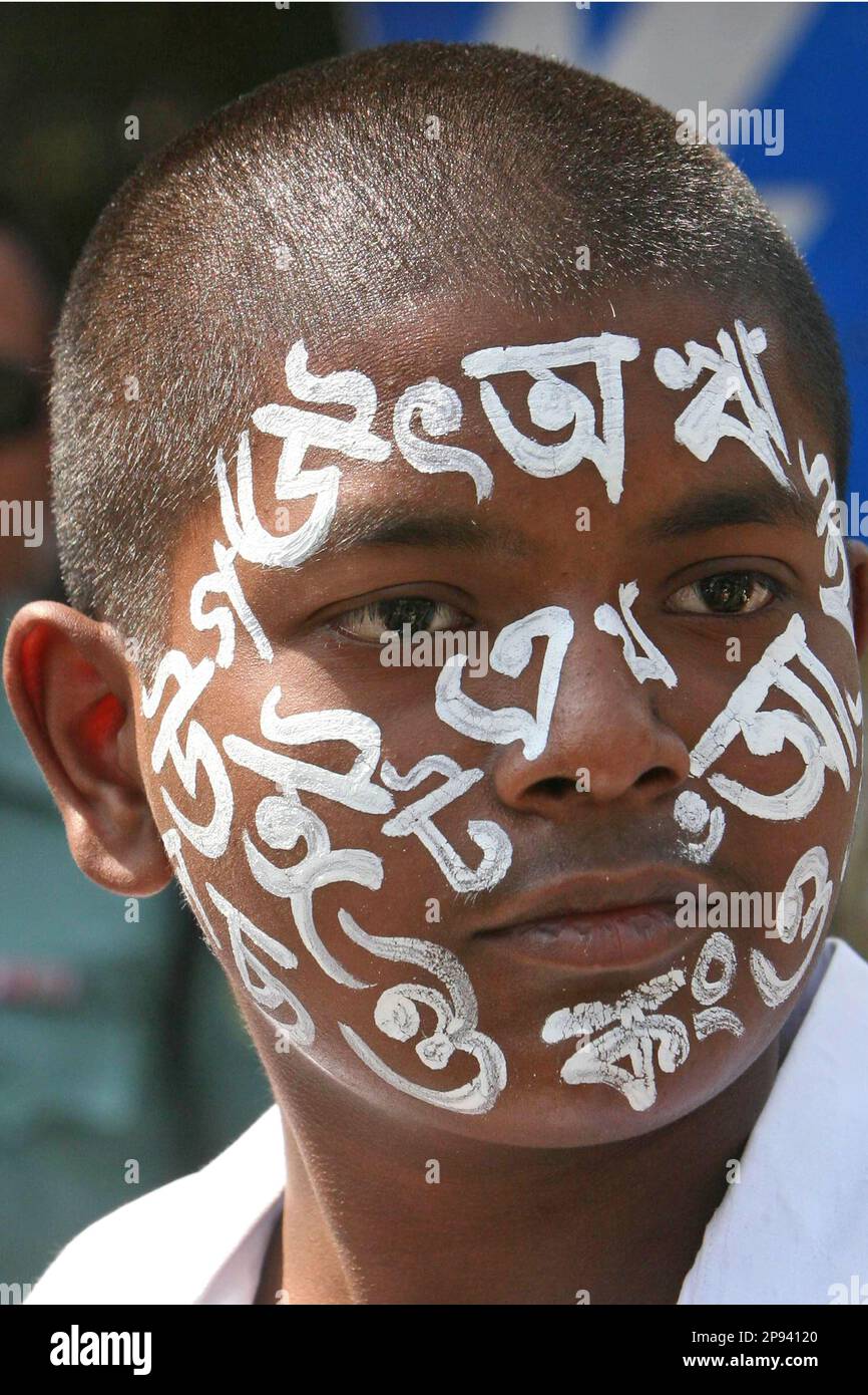 A Bangladeshi student, face painted with Bangla alphabets, pays tribute ...