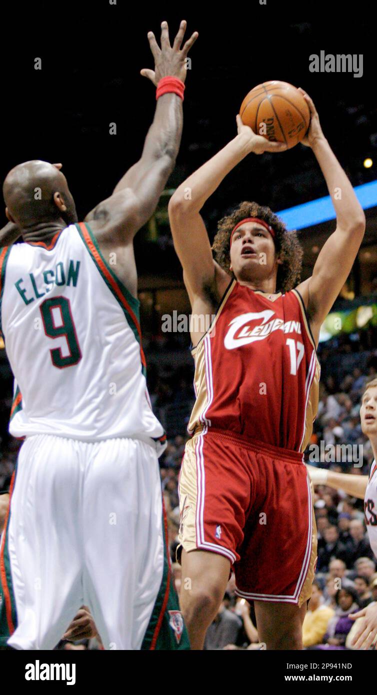 Cleveland Cavaliers' Anderson Varejao, right, takes a jump shot against ...