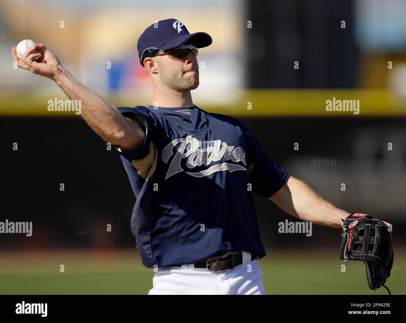 San Diego Padres infielder Kevin Kouzmanoff throws a ball during spring ...