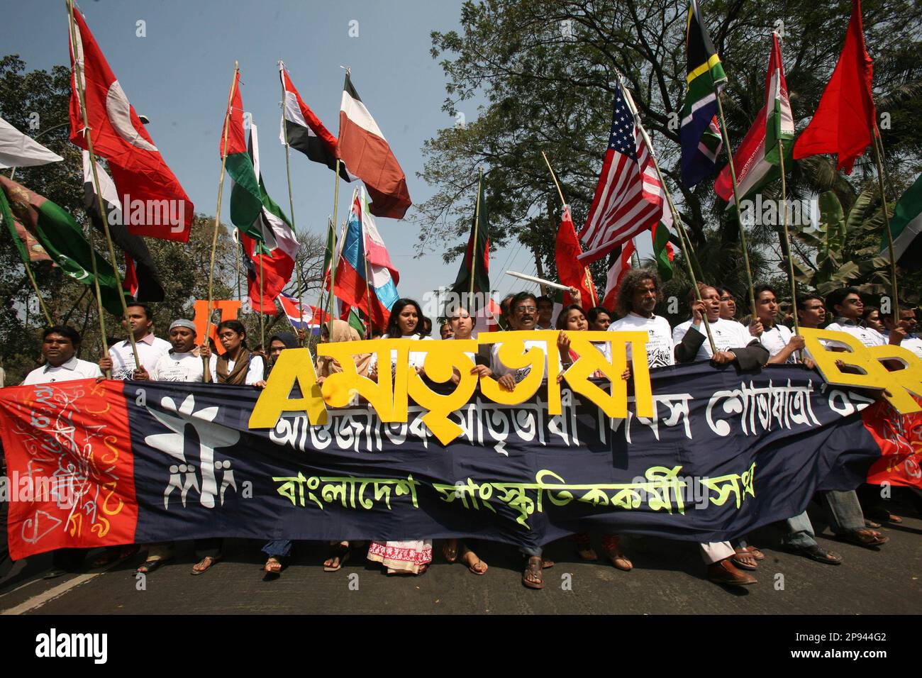 Bangladeshi cultural activists carry flags of different countries ...