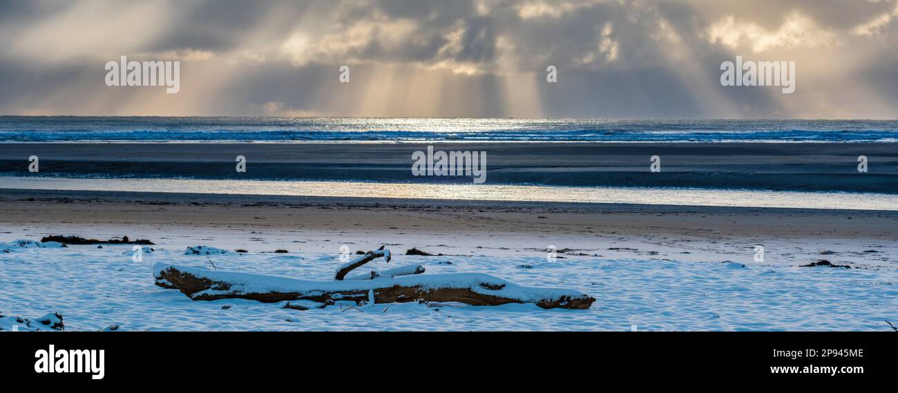 England, Northumberland, Alnmouth. Snow covered beach near the mouth of ...