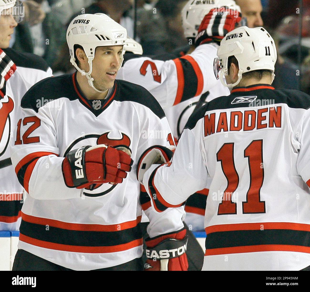 New Jersey Devils' Brian Rolston (12) celebrates with John Madden (11 ...