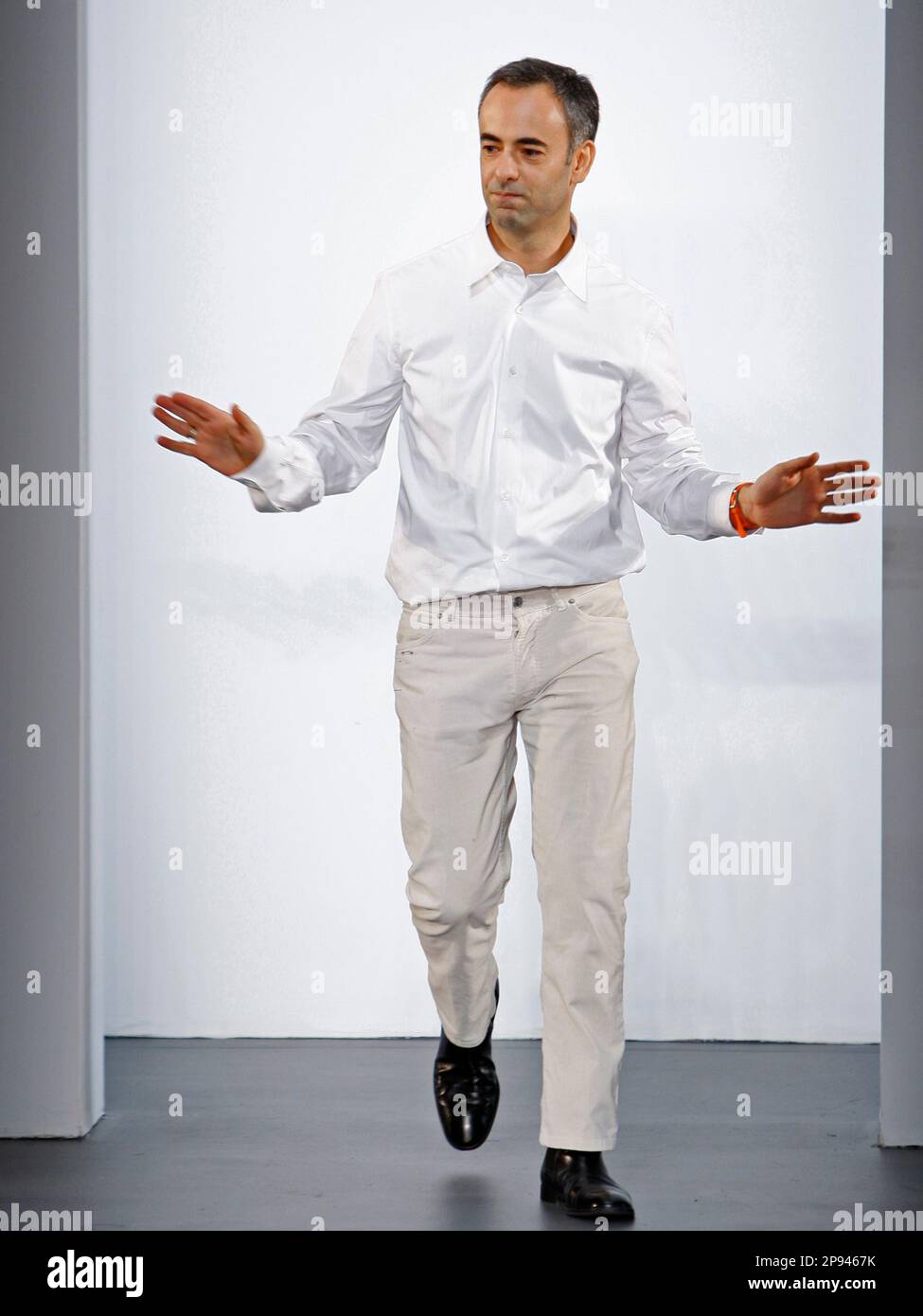Calvin Klein designer Francisco Costa is shown following the ...