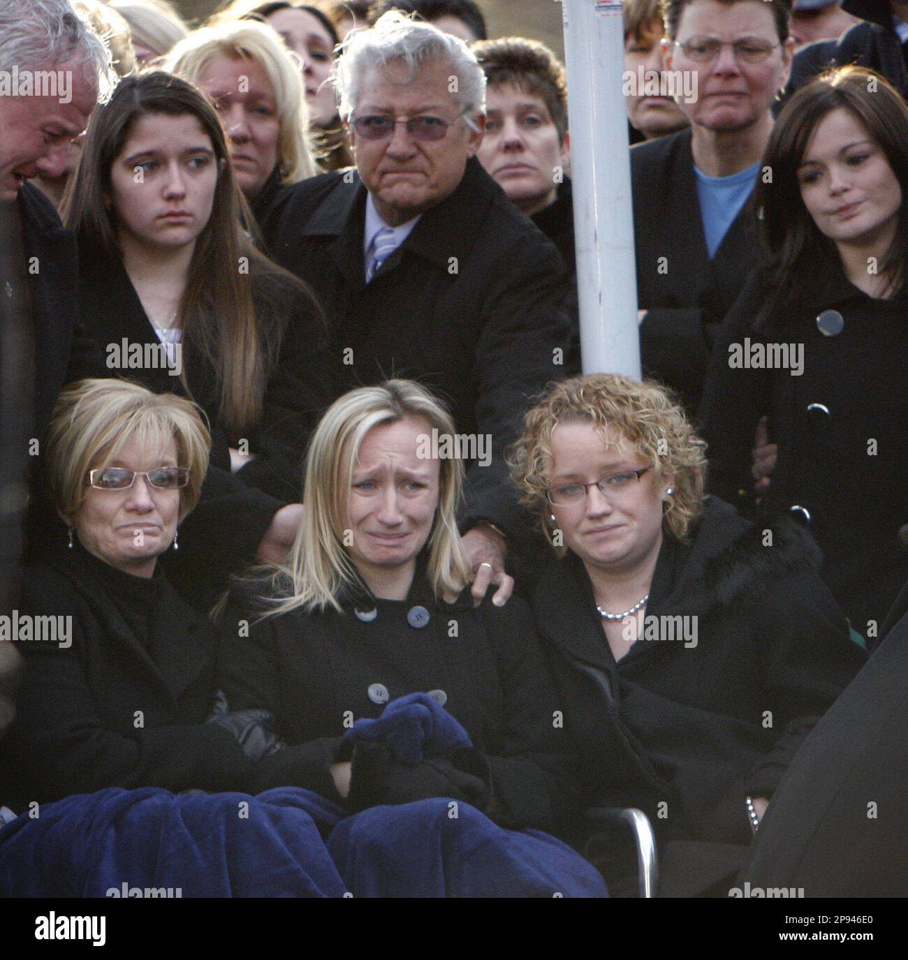 Kimberly Pawlowski, seated at center, widow of slain Philadelphia ...