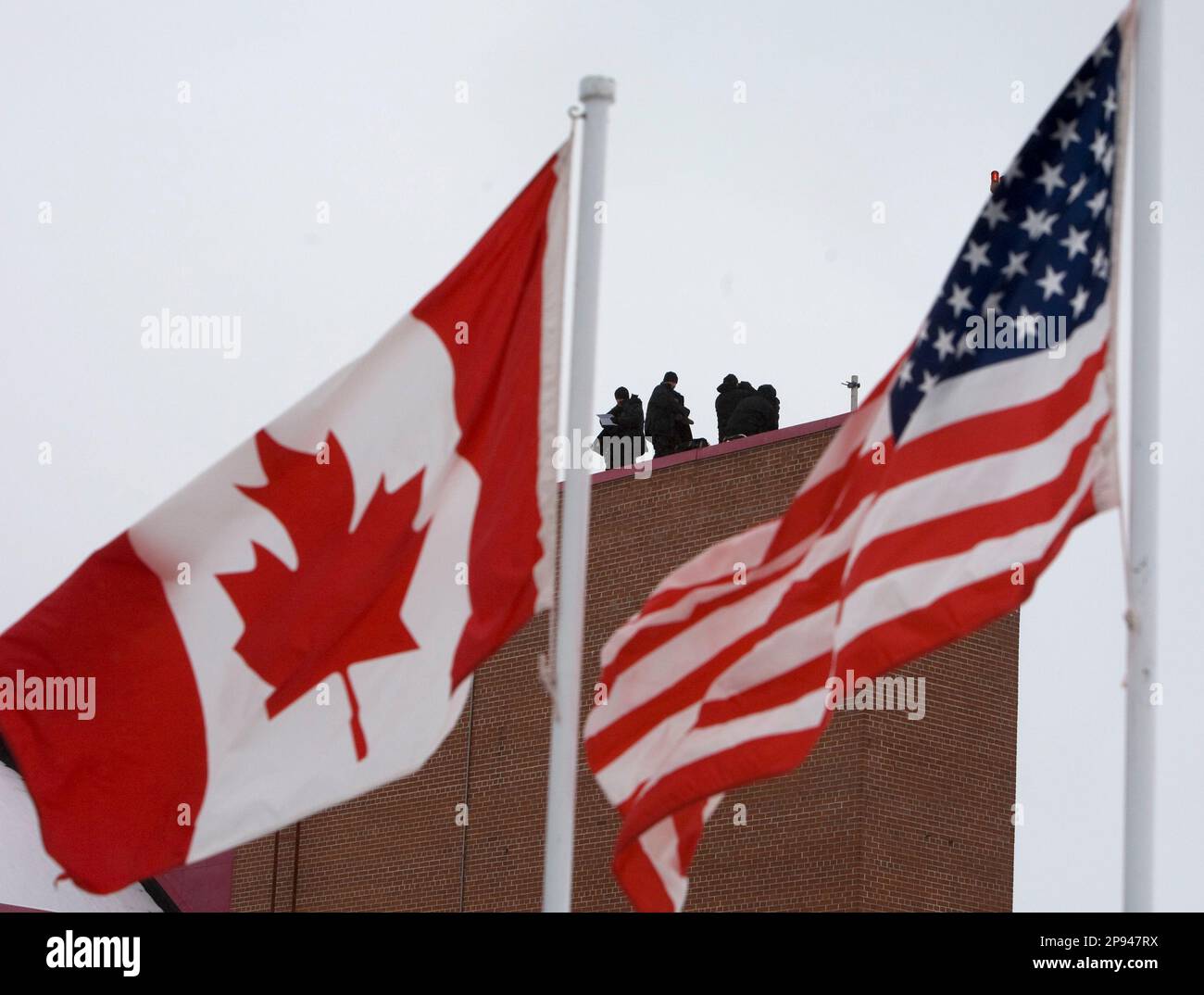 Security forces stand on the roof of the terminal building for the ...