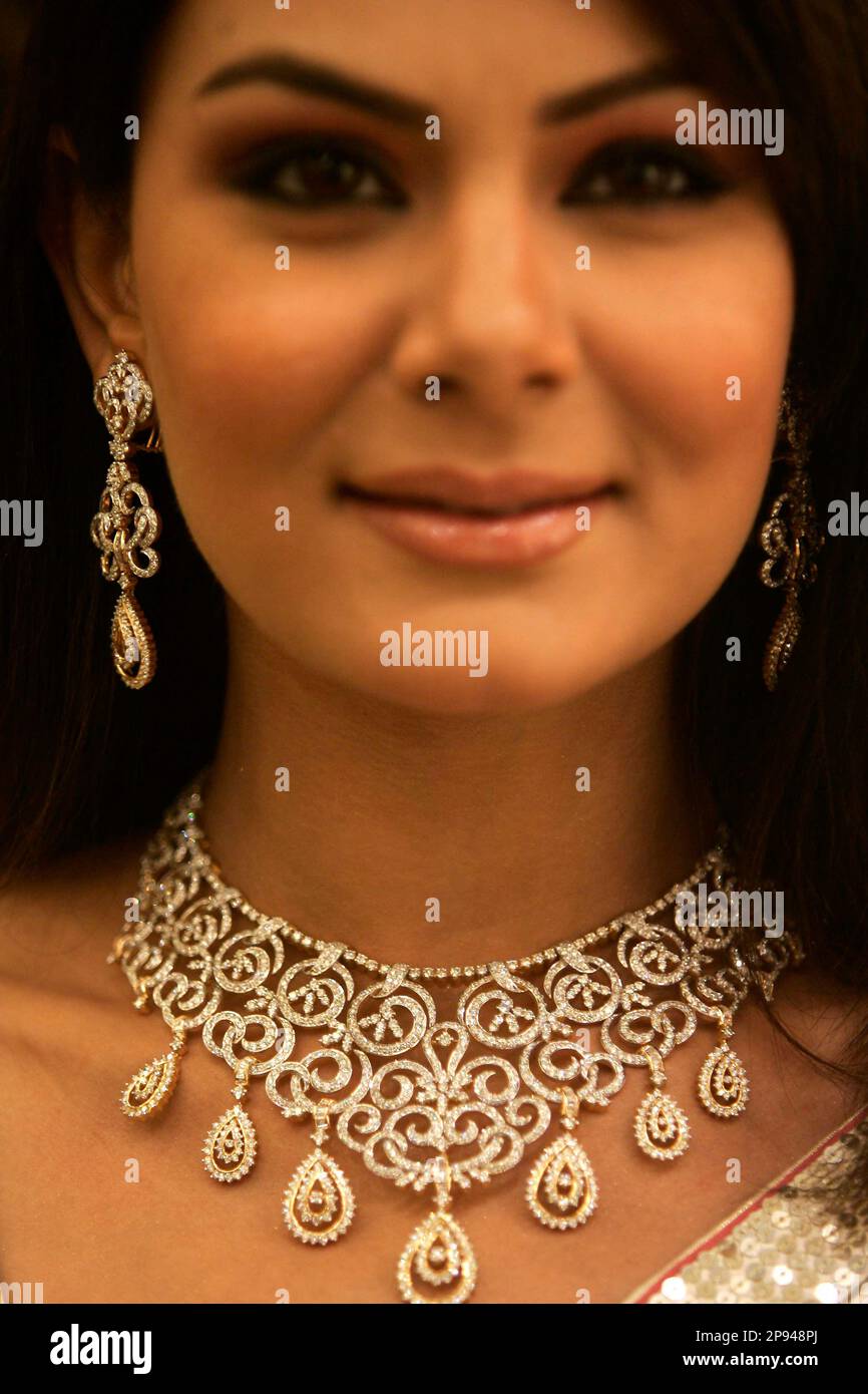 A model displays a diamond jewelry collection for bridal wear in ...
