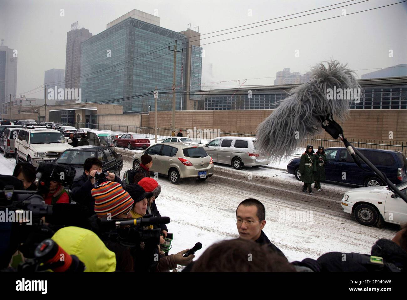 Greenpeace Campaign Director Sze Pang Cheung, bottom center, talks to ...
