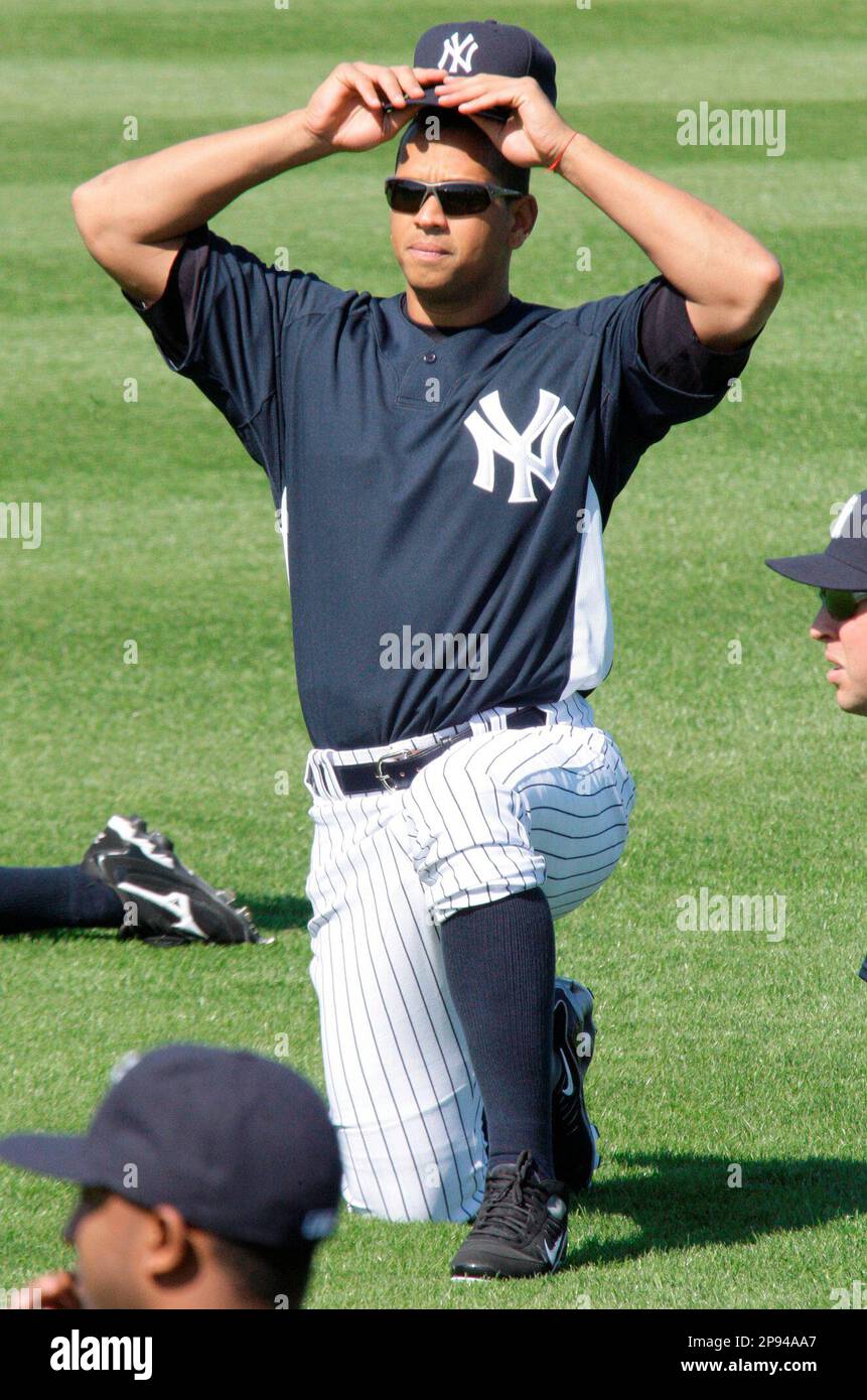 New York Yankees' Alex Rodriguez stretches in the outfield during a ...