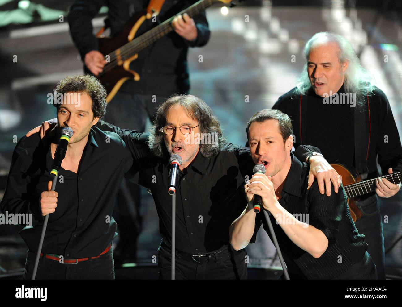 Italian singer Franz Di Cioccio, center, Italian actors Stefano Accorsi ...