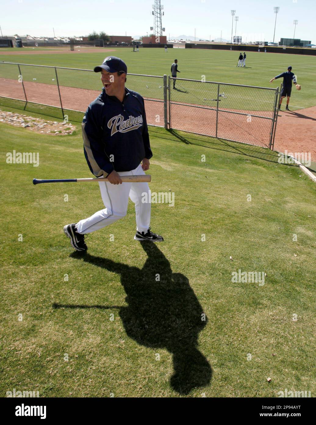 Former San Diego Padres pitcher Greg Maddux laughs with a friend as he ...