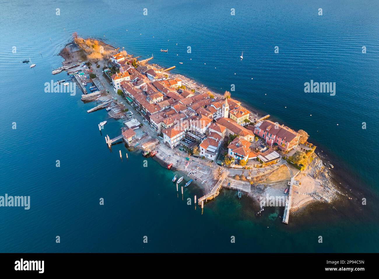 Aerial view of Isola dei Pescatori during a winter sunrise. Lago ...