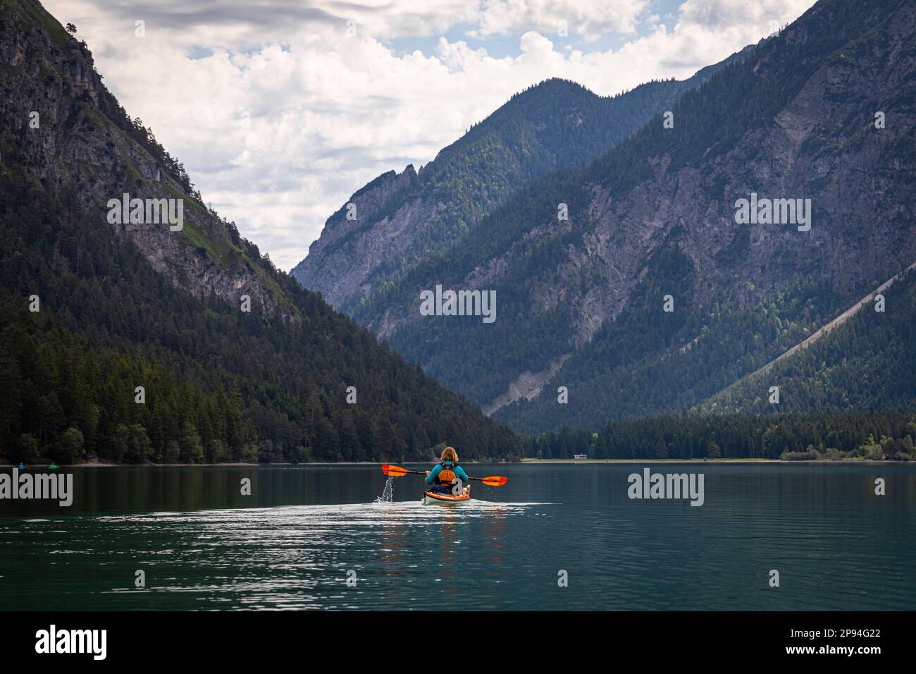 Sea kayaker (60 years) on the Heiterwanger lake Stock Photo - Alamy