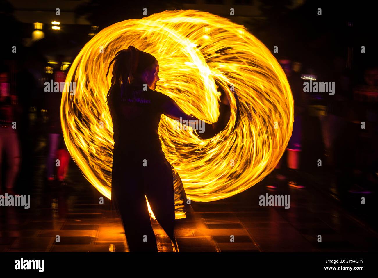 Street performer at night with fire show Stock Photo - Alamy
