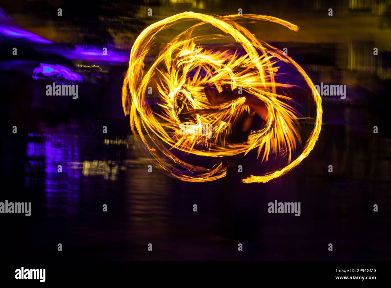Street performer at night with fire show Stock Photo - Alamy