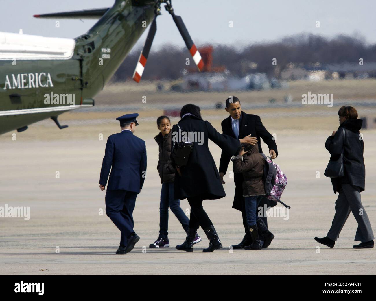 President Barack Obama walks with his family Malia, first lady Michelle ...