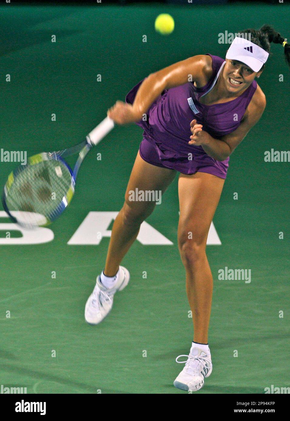 Ana Ivanovic from Serbia serves the ball to Russia's Alisa Kleybanova ...