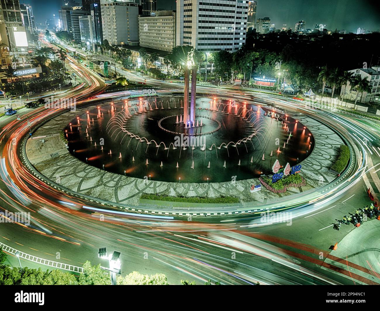 Heavy traffic circles around a roundabout in the central part of ...