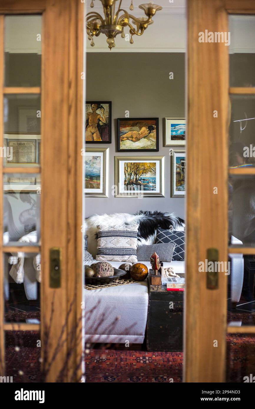 View into the living room through a glass sliding door Stock Photo - Alamy
