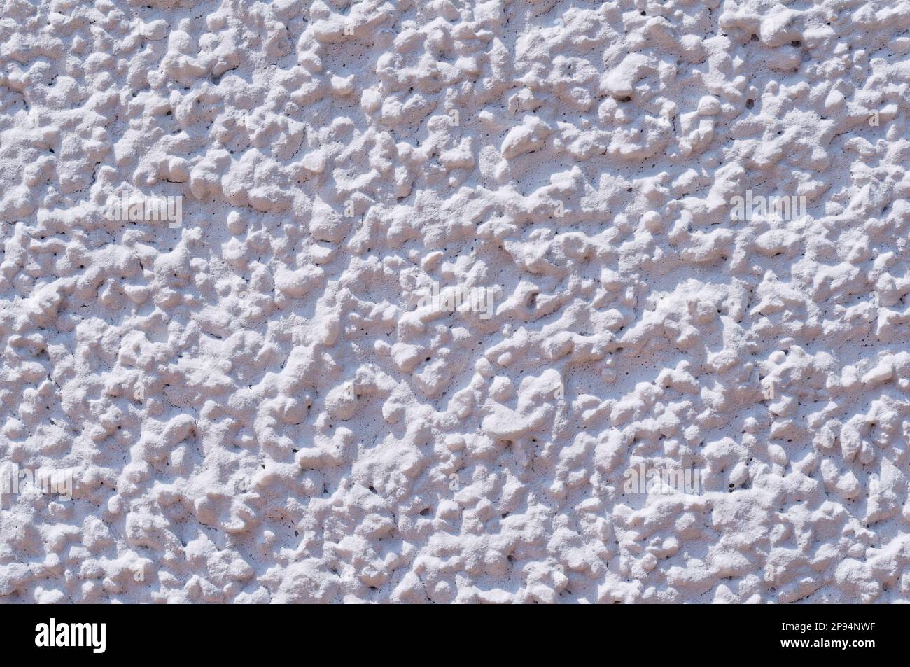 A close-up of a popcorn-textured white wall Stock Photo - Alamy