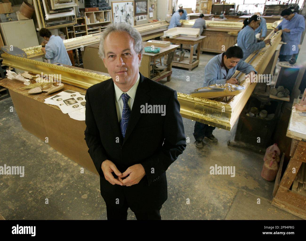 Eli Wilner poses for a portrait as workers restore a replica of the ...