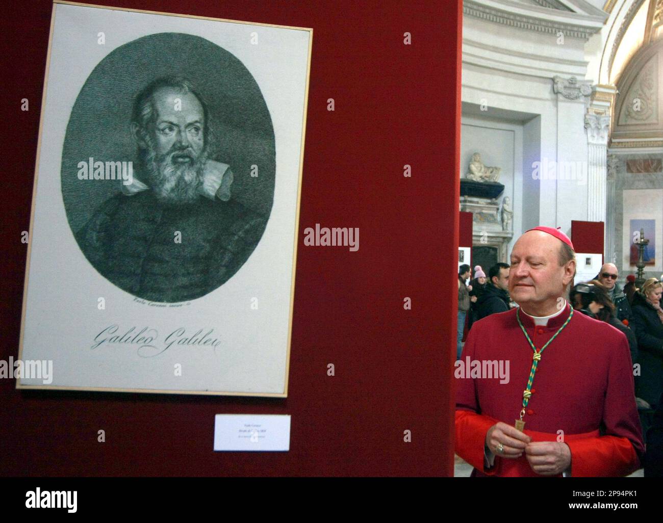 Monsignor Gianfranco Ravasi looks on near a portrait of Italian ...