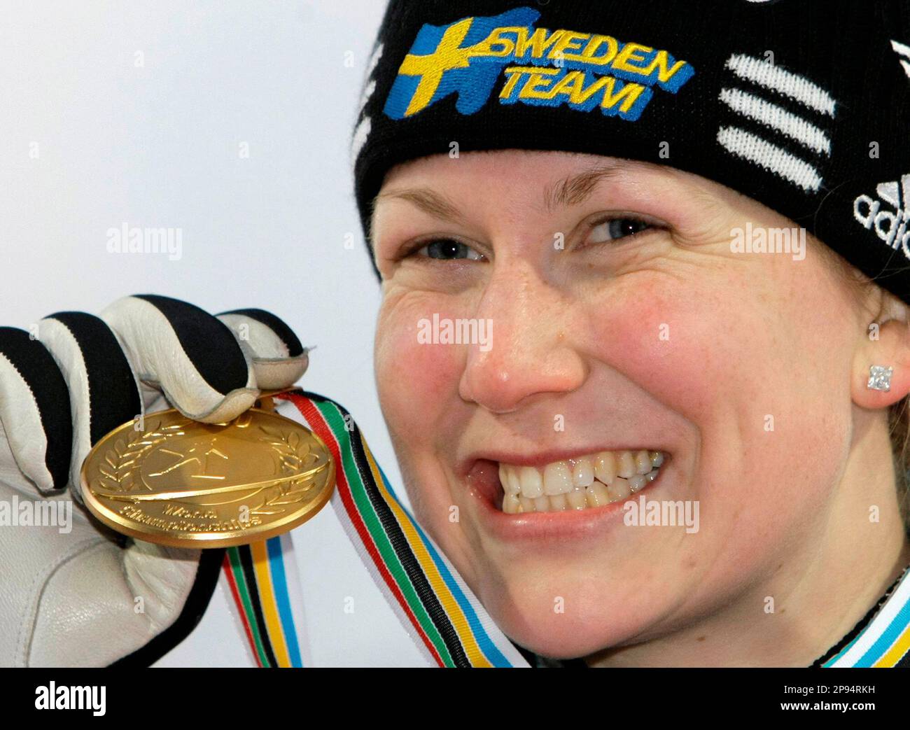 Helena Jonsson of Sweden shows off her gold medal during the medal ...