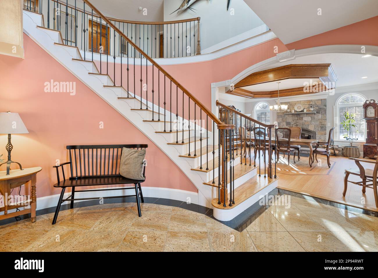 A two-story house, featuring a staircase connecting the ground floor to ...
