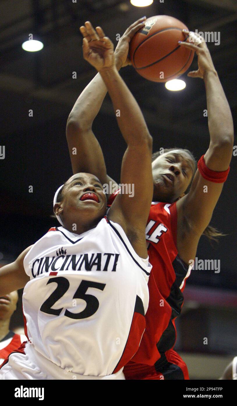 Louisville center Keshia Hines, right, steals the ball from Cincinnati ...