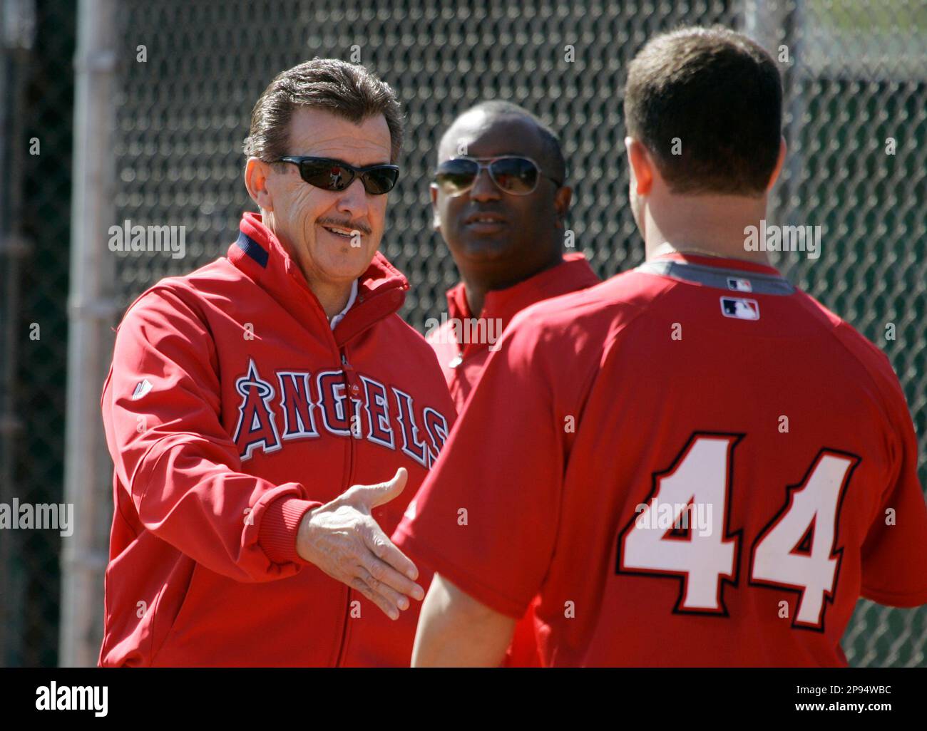 Los Angeles Angels owner Arte Moreno, left, greets catcher Mike Napoli ...