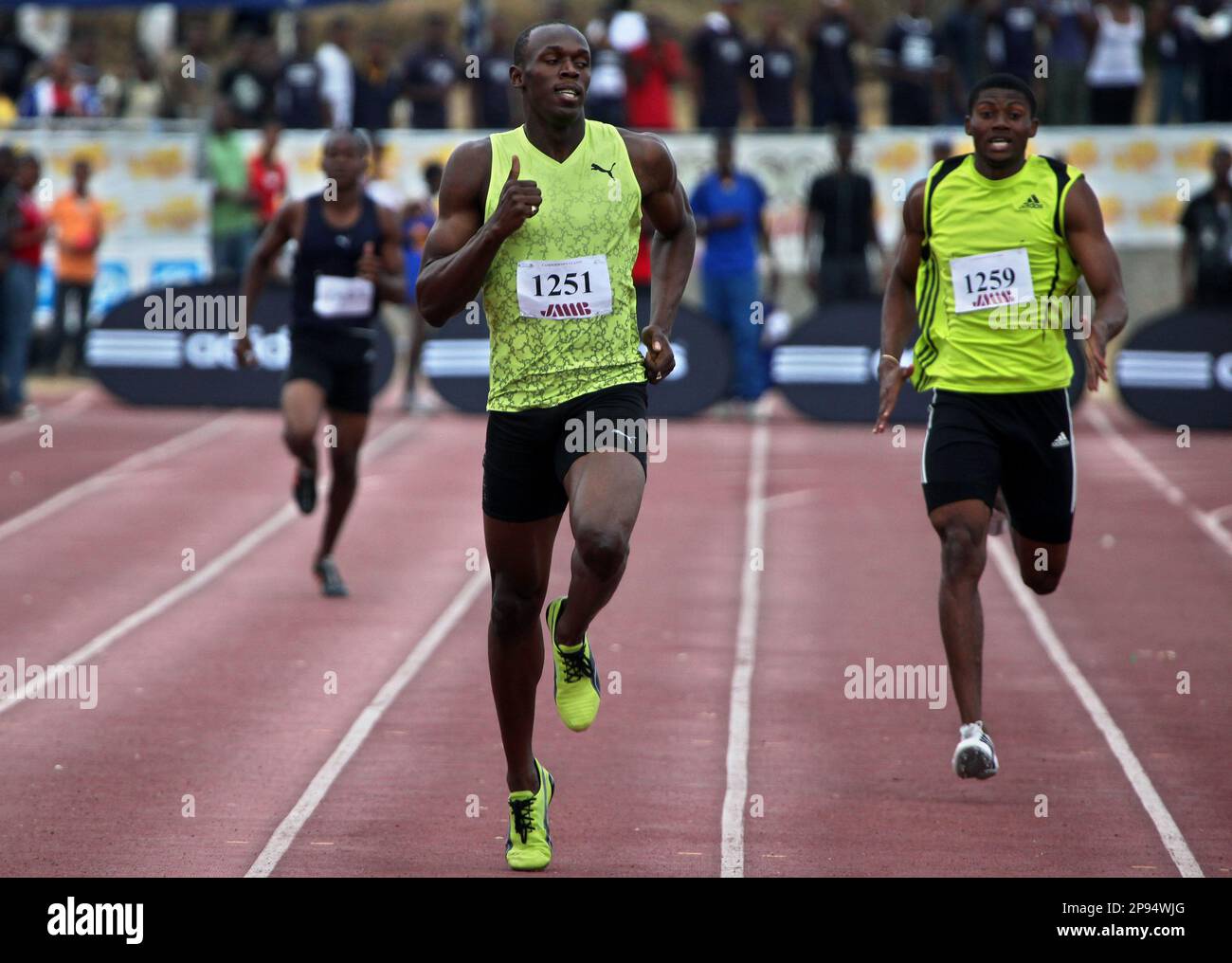 World champion Jamaican sprinter Usain Bolt, center, runs the 400 ...